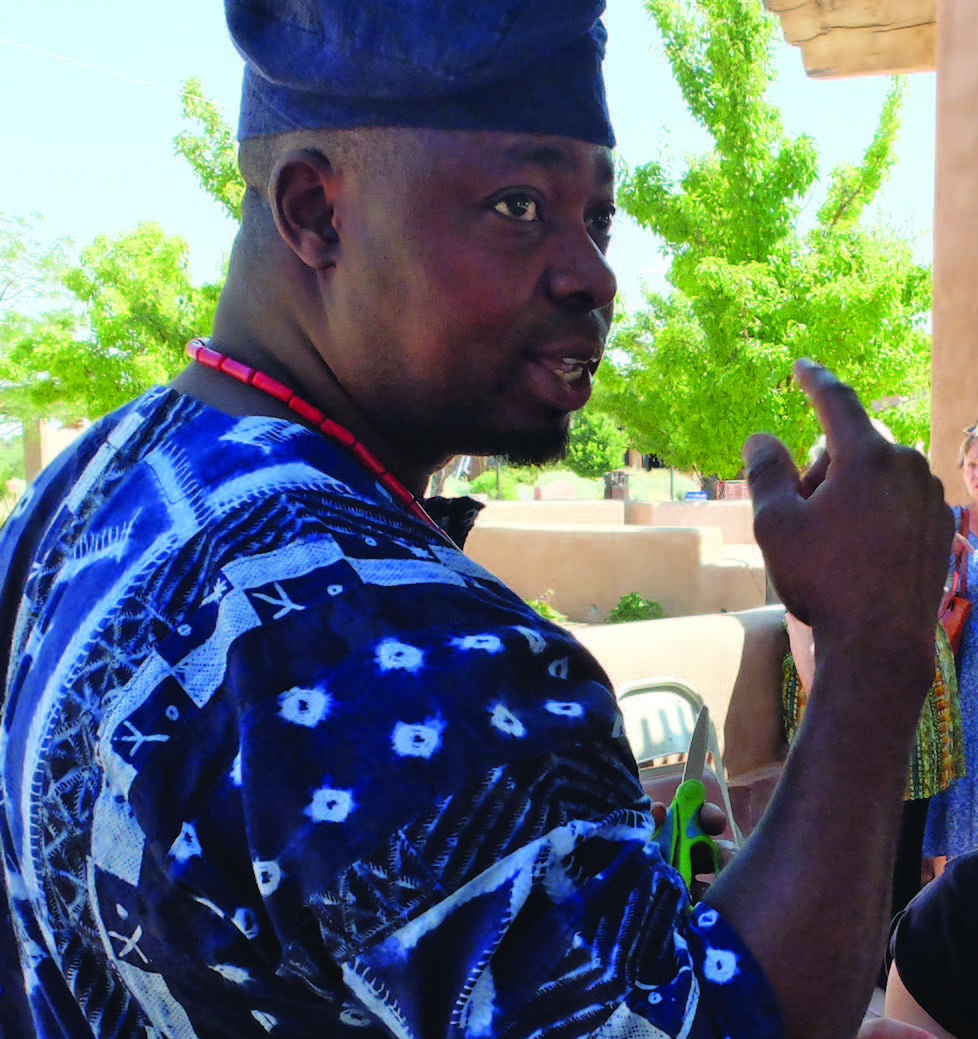 Gasali Adeyemo, left, works with Creativity for Peace participants at a ...